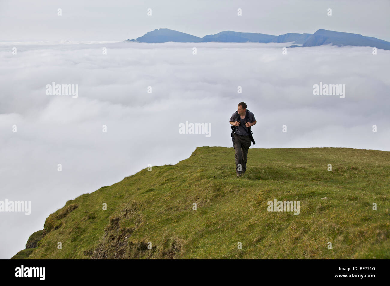 Hiker on mountain ridge, Isle of Skye, Scotland Stock Photo - Alamy