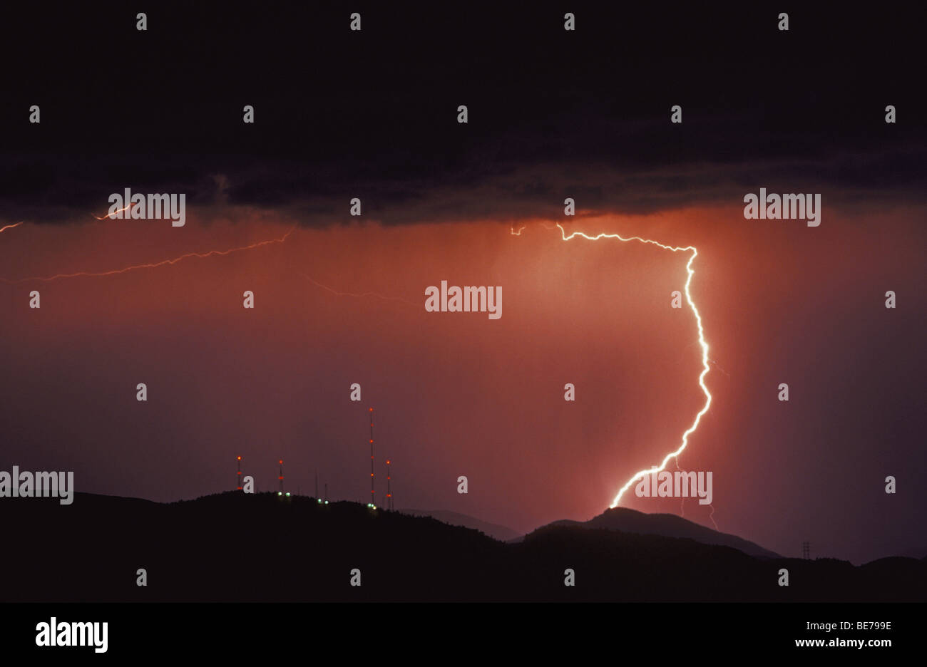 Bolt of lightning strikes near television broadcast towers on Lookout ...