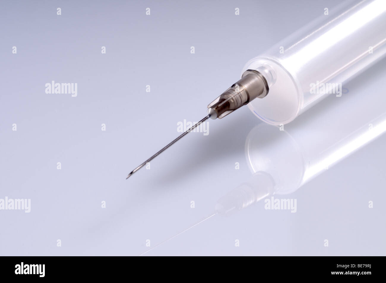 Plastic syringe and a needle on a white background Stock Photo - Alamy