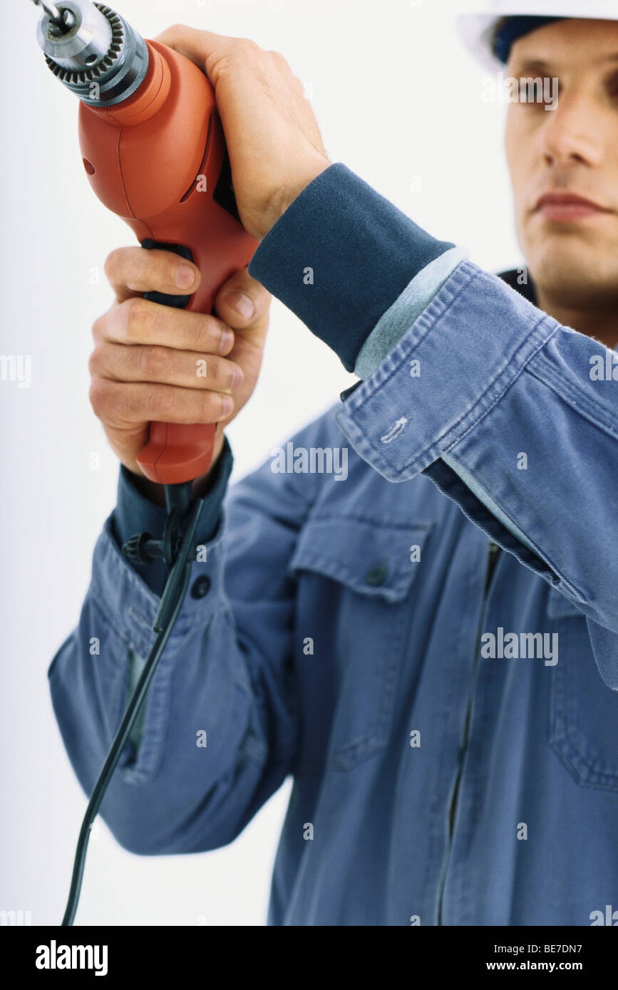 Handyman using drill Stock Photo - Alamy