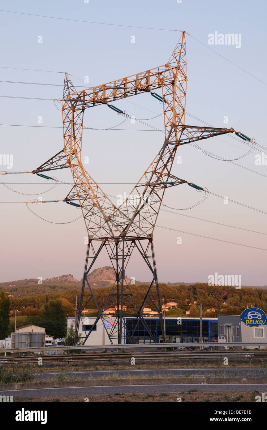 Huge electricity pylons at dusk Stock Photo - Alamy