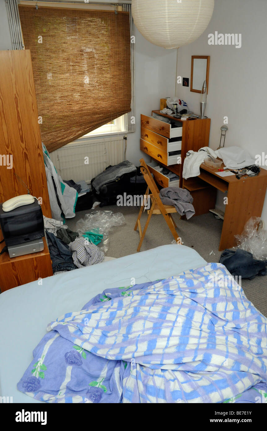 Untidy, cluttered bedroom in disarray, messy bed boys room Stock Photo ...