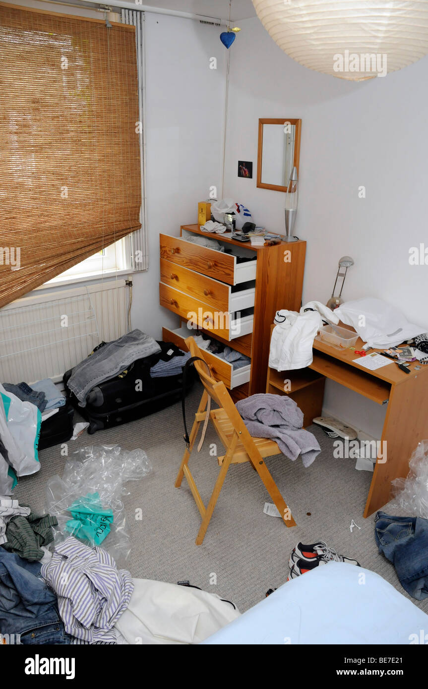 Untidy, cluttered bedroom in disarray, messy bed boys room Stock Photo ...