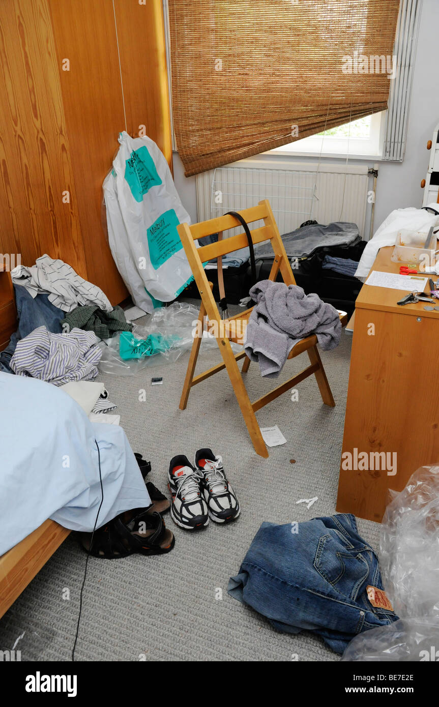 Untidy, cluttered bedroom in disarray, messy bed boys room Stock Photo ...