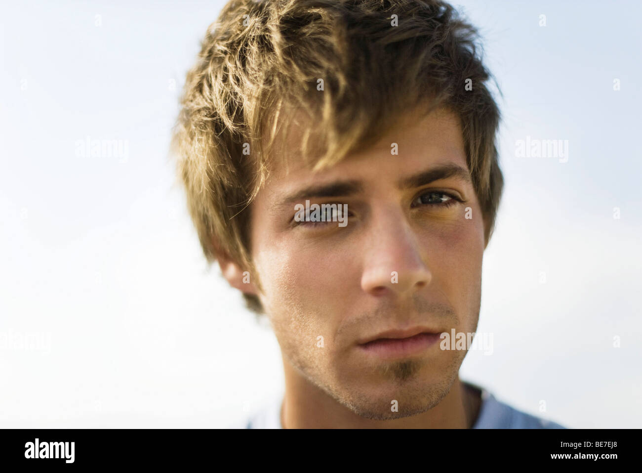 Young man looking at camera, portrait Stock Photo - Alamy