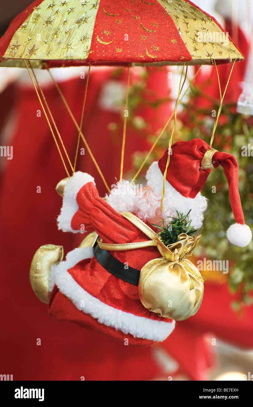 Christmas decoration featuring Santa Claus hanging from parachute Stock ...