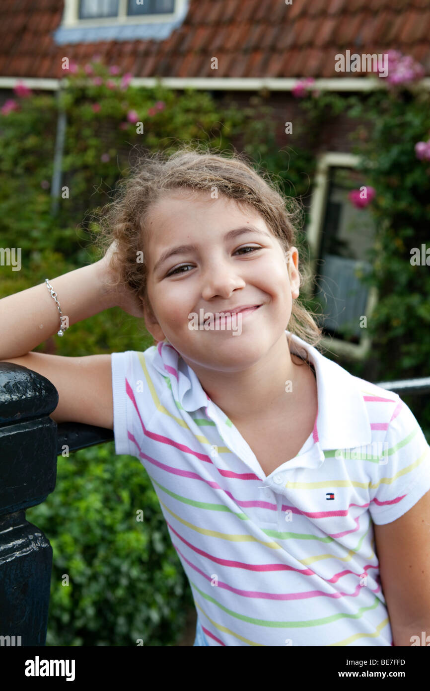 Portrait of a young 9 years old schoolgirl smiling to the camera Stock ...