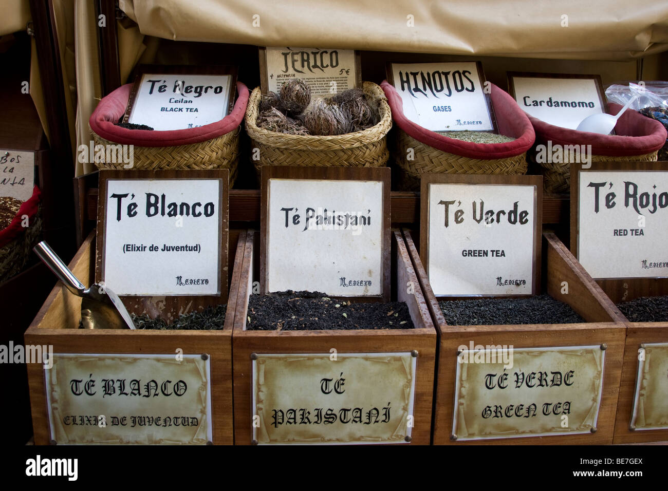 Boxes and baskets with labels in Spanish showing different varieties of ...