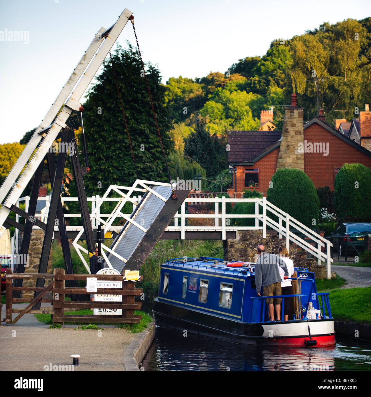 Narrowboat passing under a tilting lifting bridge on the Llangollen ...