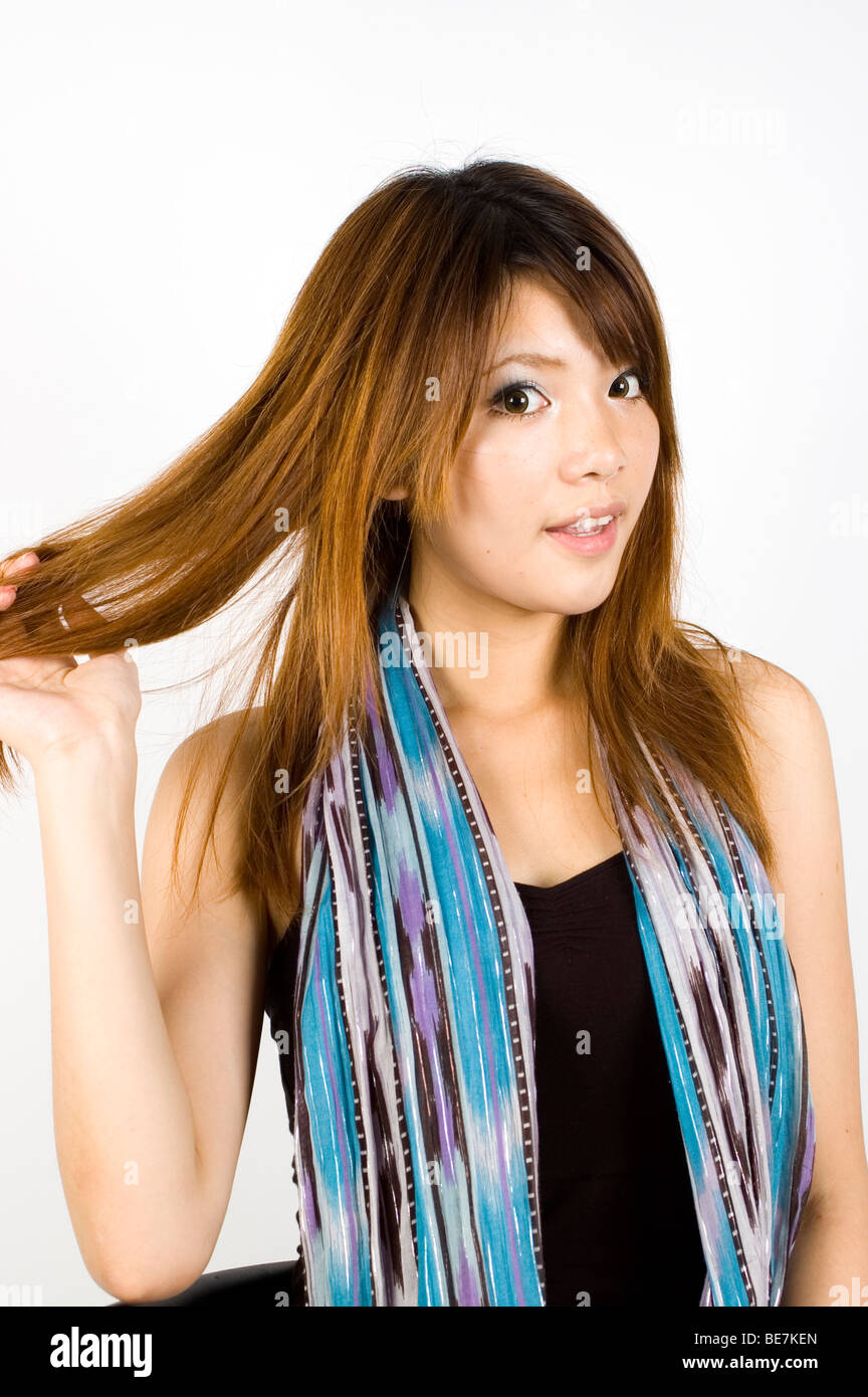 Cute, young and pretty Chinese teenager, portrait with kind face ...