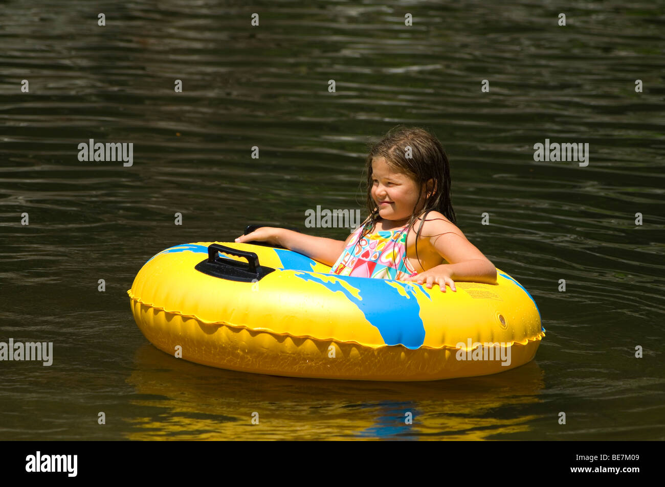 Girl Floating On Inner Tube High Resolution Stock Photography and ...