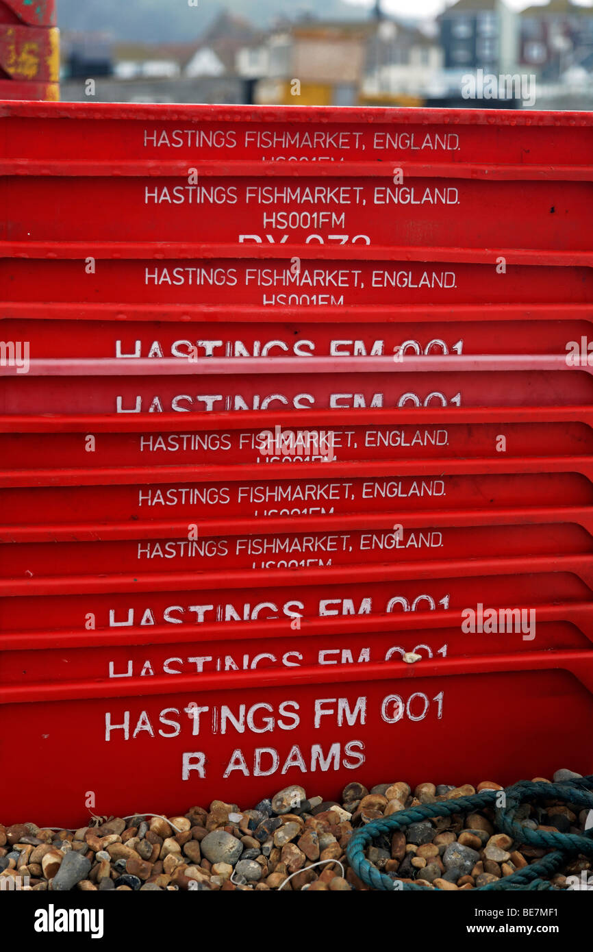 Empty red fish crates on Hastings beach Stock Photo - Alamy