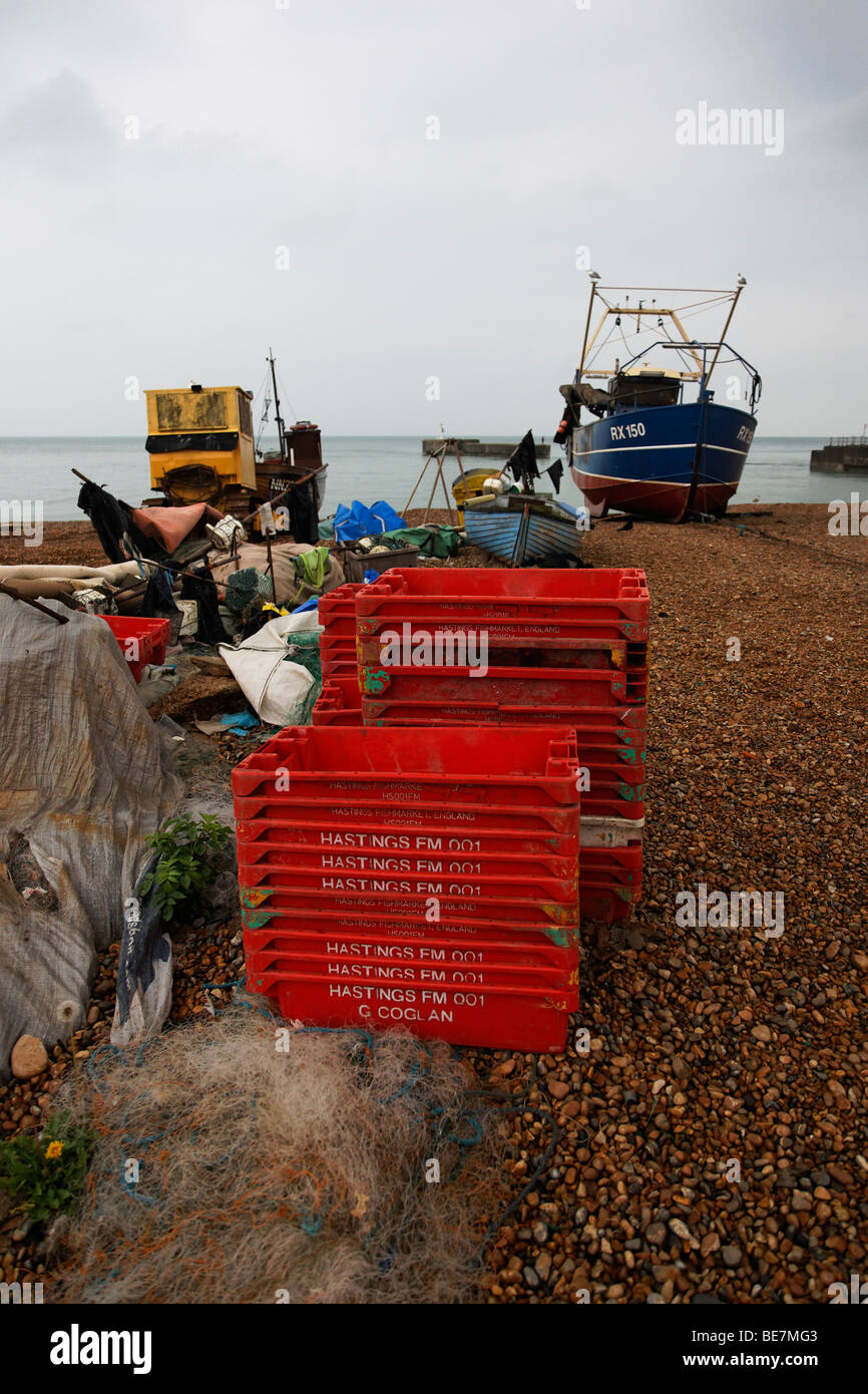 Empty red fish crates on Hastings beach Stock Photo - Alamy