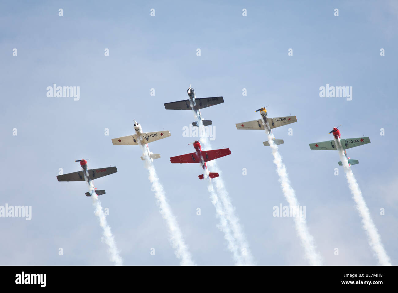 Airplanes performing aerobatic stunt at airshow Stock Photo - Alamy