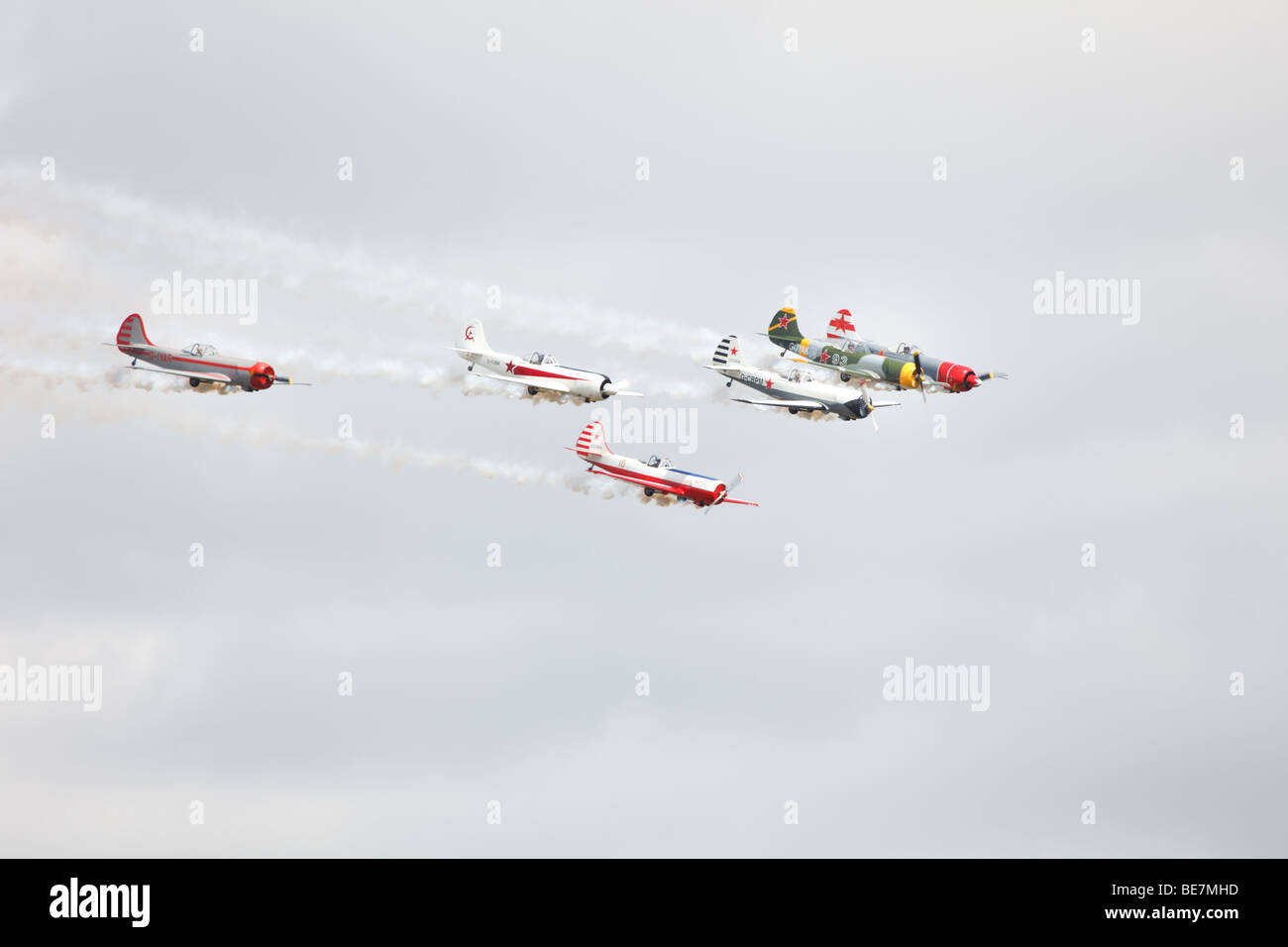 Airplanes performing aerobatic stunt at airshow Stock Photo - Alamy