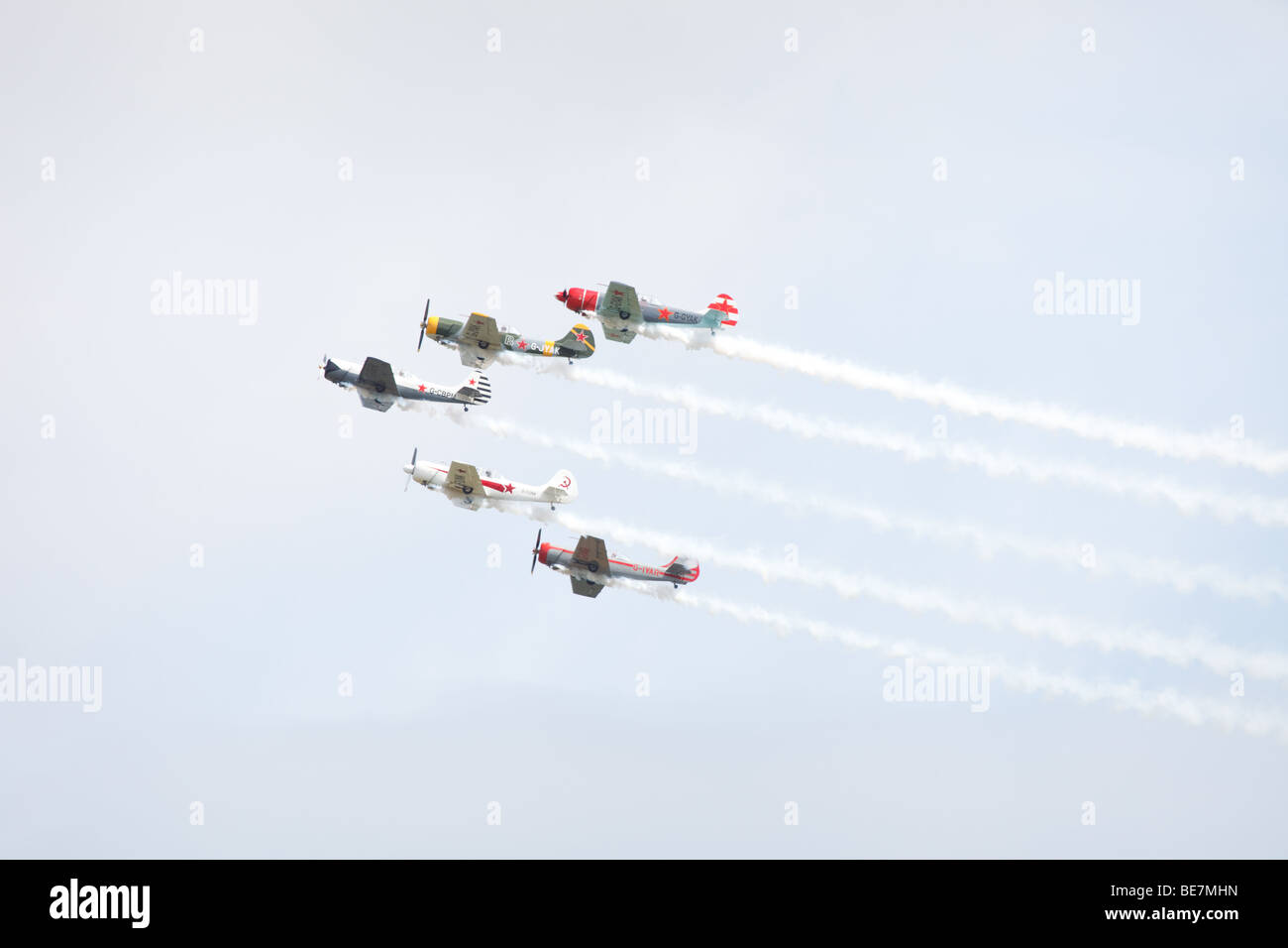 Airplanes performing aerobatic stunt at airshow Stock Photo - Alamy