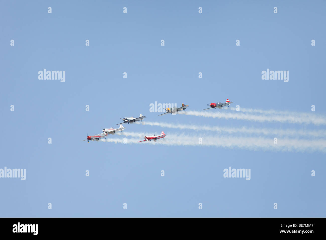 Airplanes performing aerobatic stunt at airshow Stock Photo - Alamy