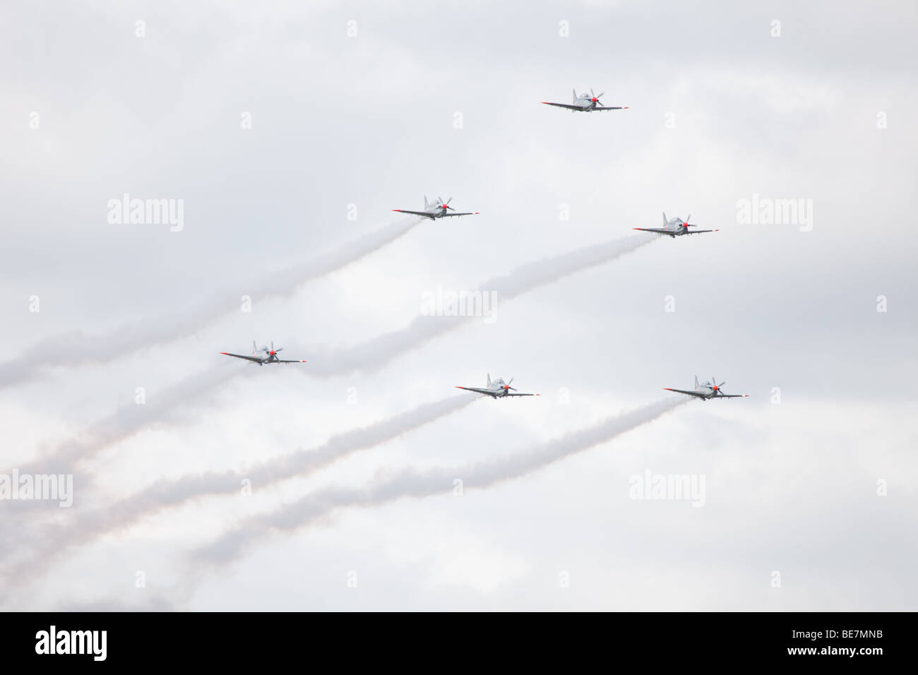 Airplanes performing aerobatic stunt at airshow Stock Photo - Alamy