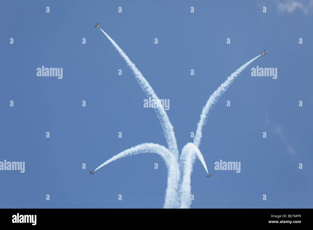 Four airplanes performing aerobatic stunt Stock Photo - Alamy