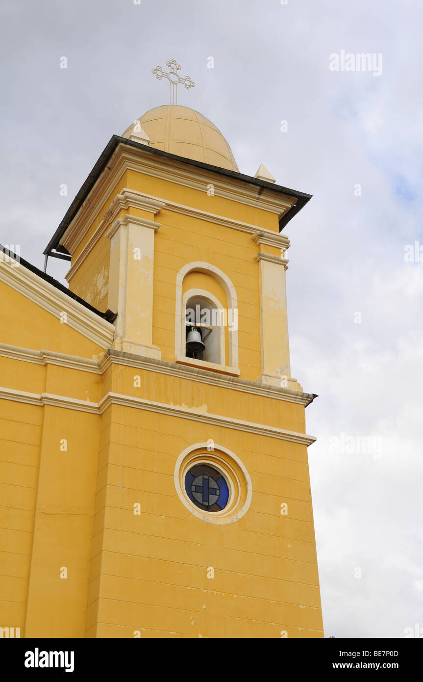 Bell tower of old church painted yellow in Cajabamba, Peru Stock Photo ...