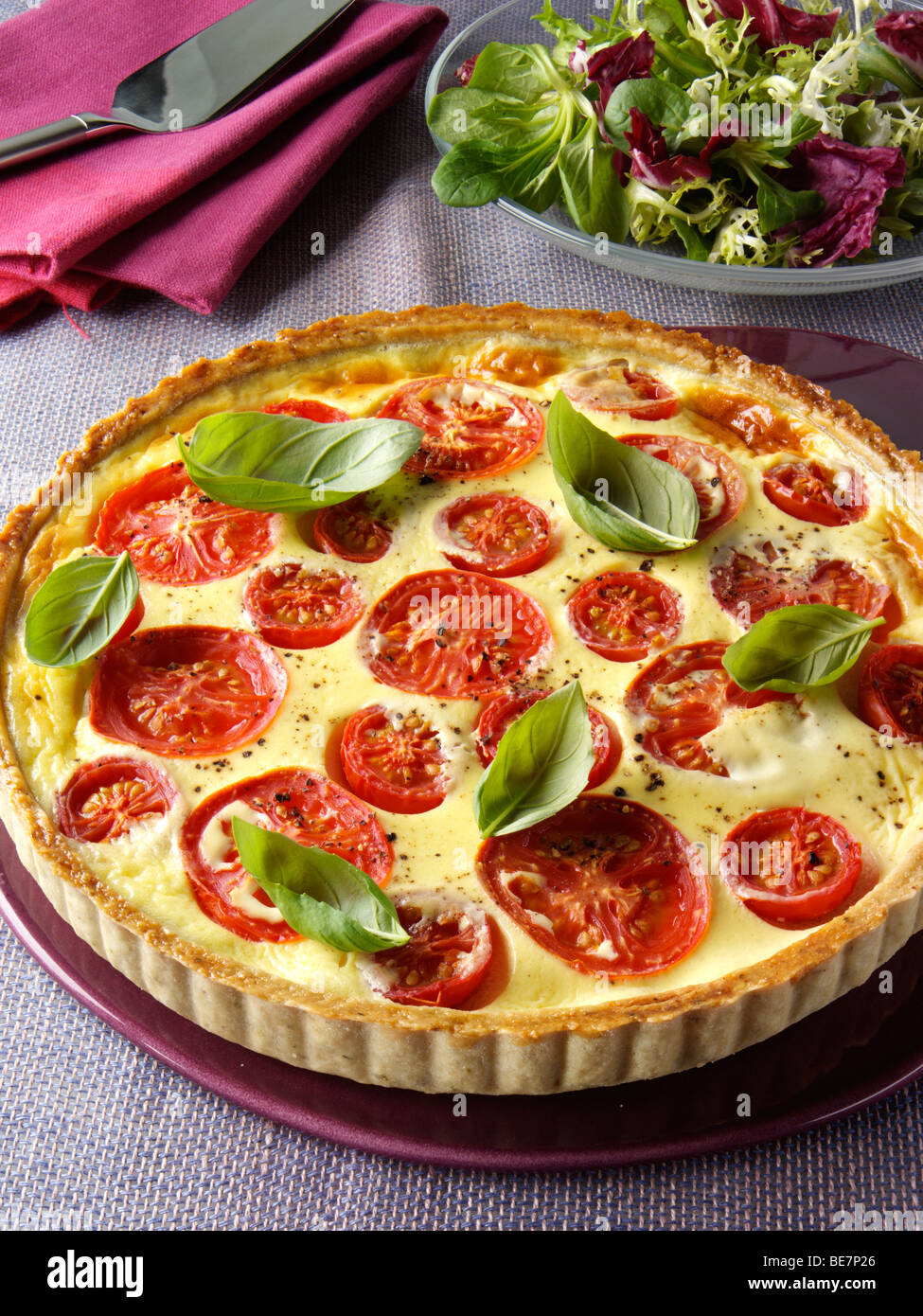 Tomato quiche and salad in a table setting Stock Photo - Alamy