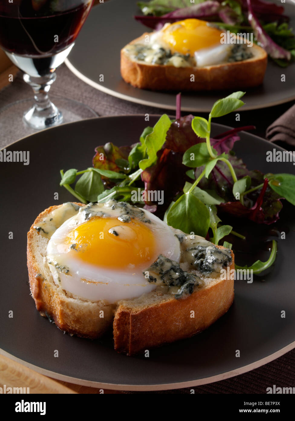 Cheese duck eggs on toast with salad Stock Photo - Alamy