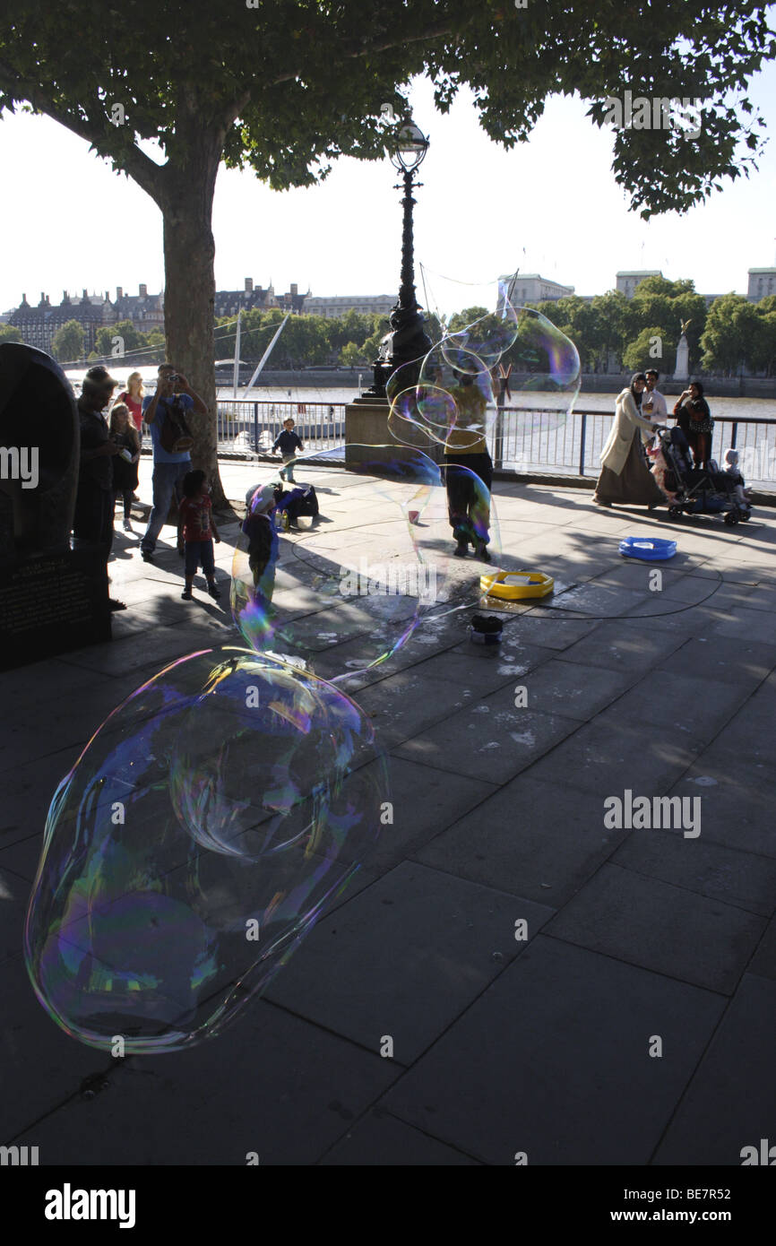 Street entertainer blowing soap bubbles South Bank London September ...