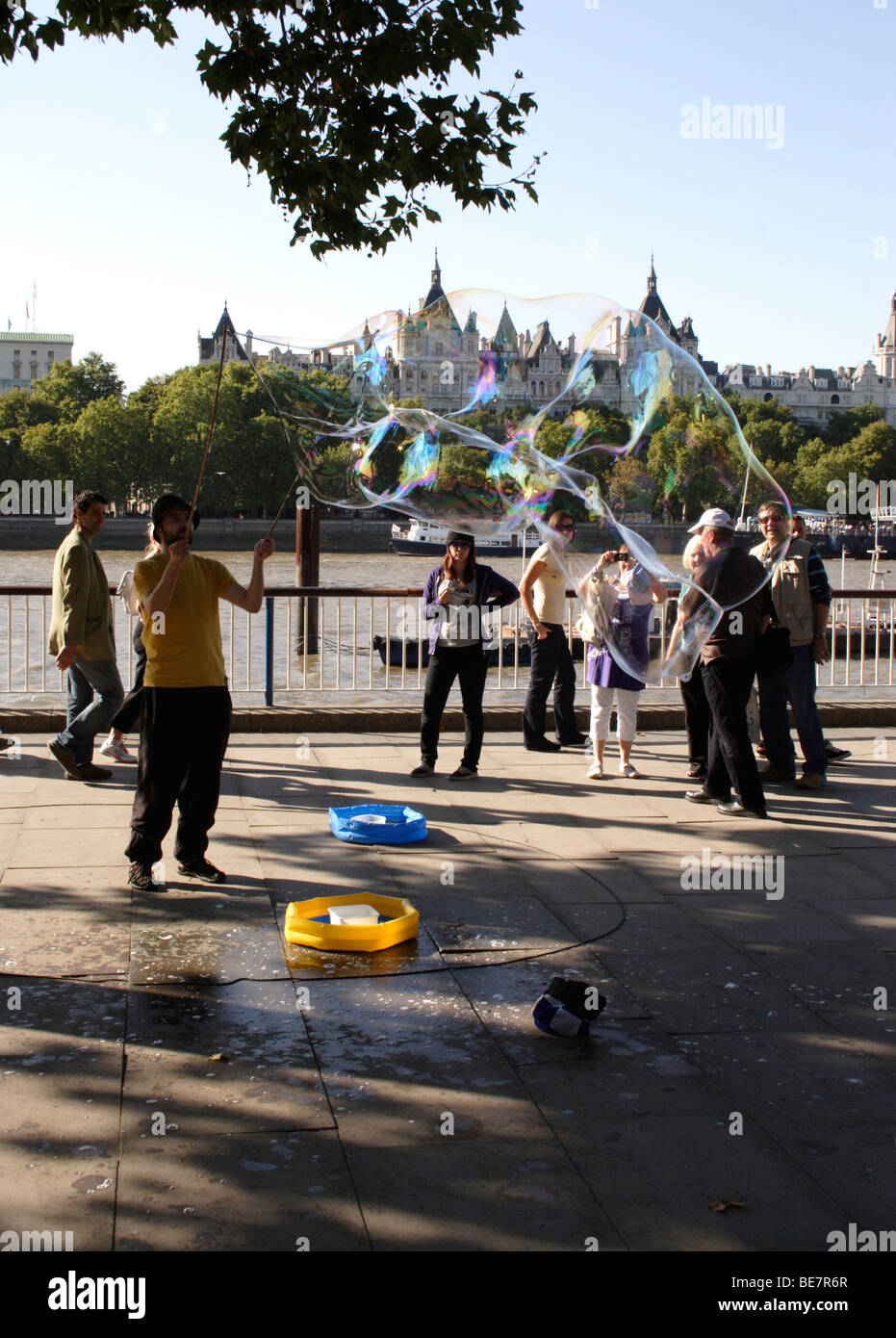 Street entertainer blowing soap bubbles South Bank London September ...
