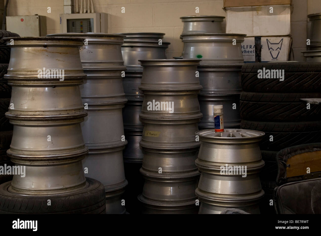 A stack of car alloy wheels and tyres Stock Photo - Alamy