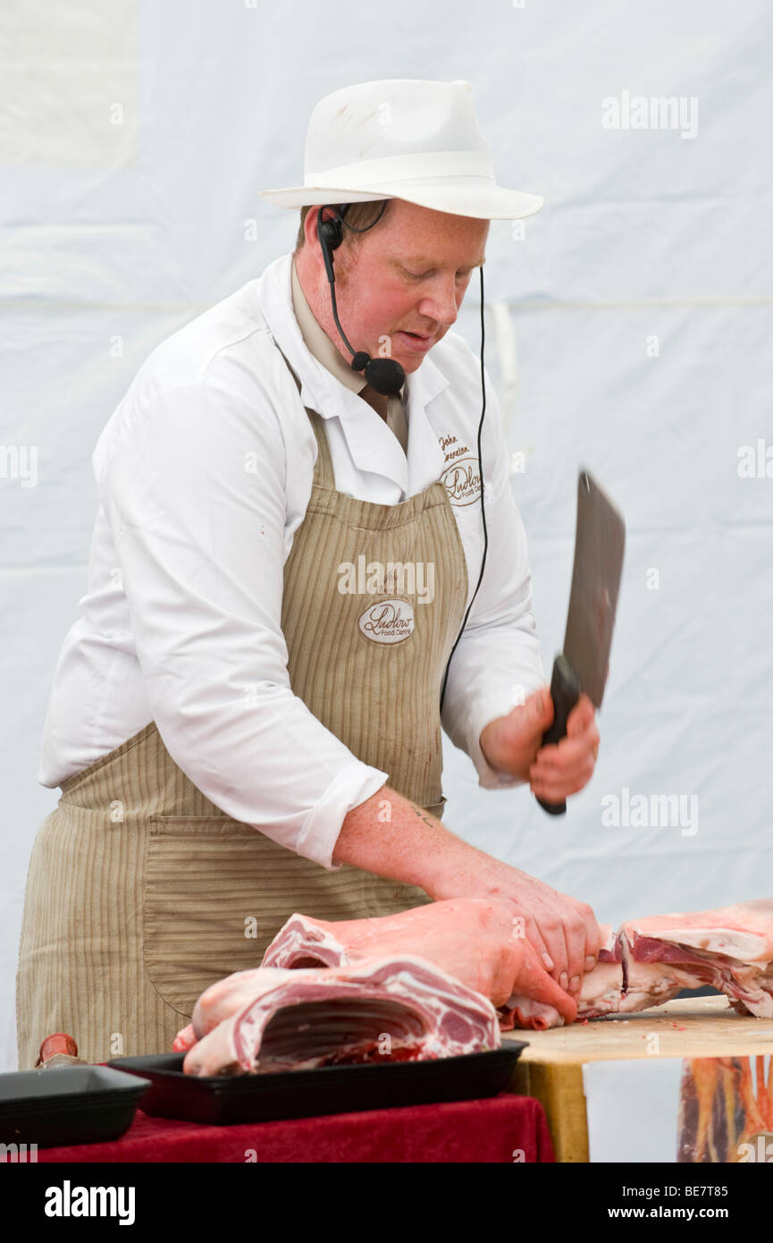 Butcher giving demonstration of cutting up lamb carcase at Ludlow Food ...