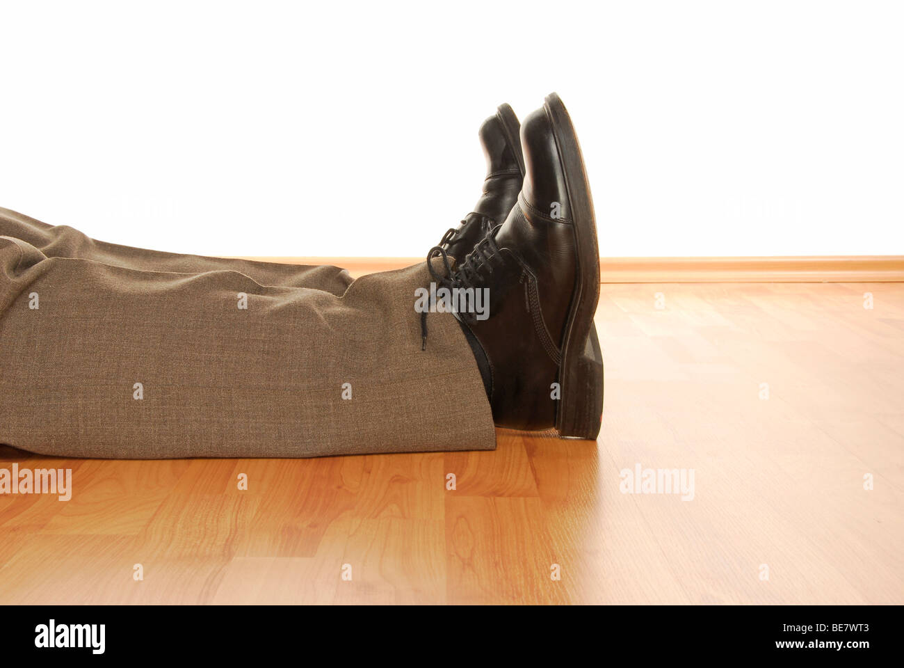 Slumped manager, symbolic image for disaster Stock Photo - Alamy