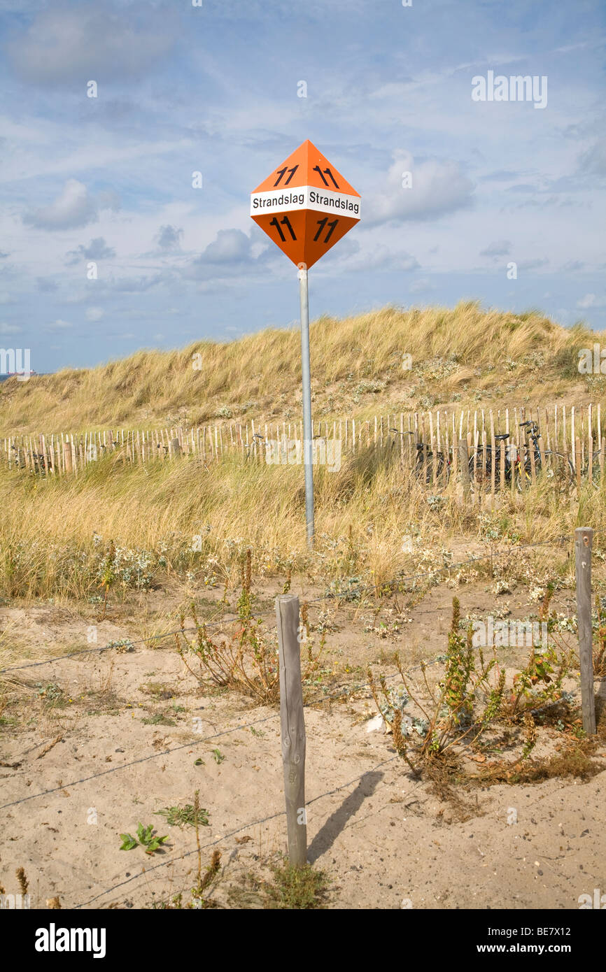 Beach marker sign in sand dunes near Scheveningen Holland Stock Photo ...