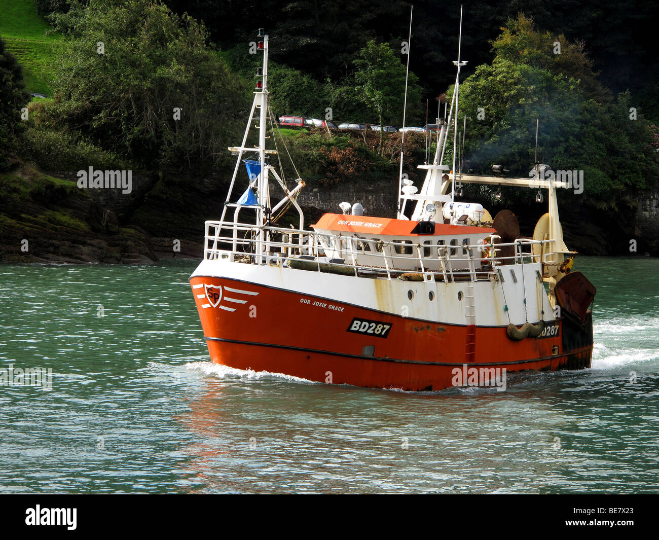 A small trawler leaving Ilfracombe harbour to go fishing Stock Photo ...