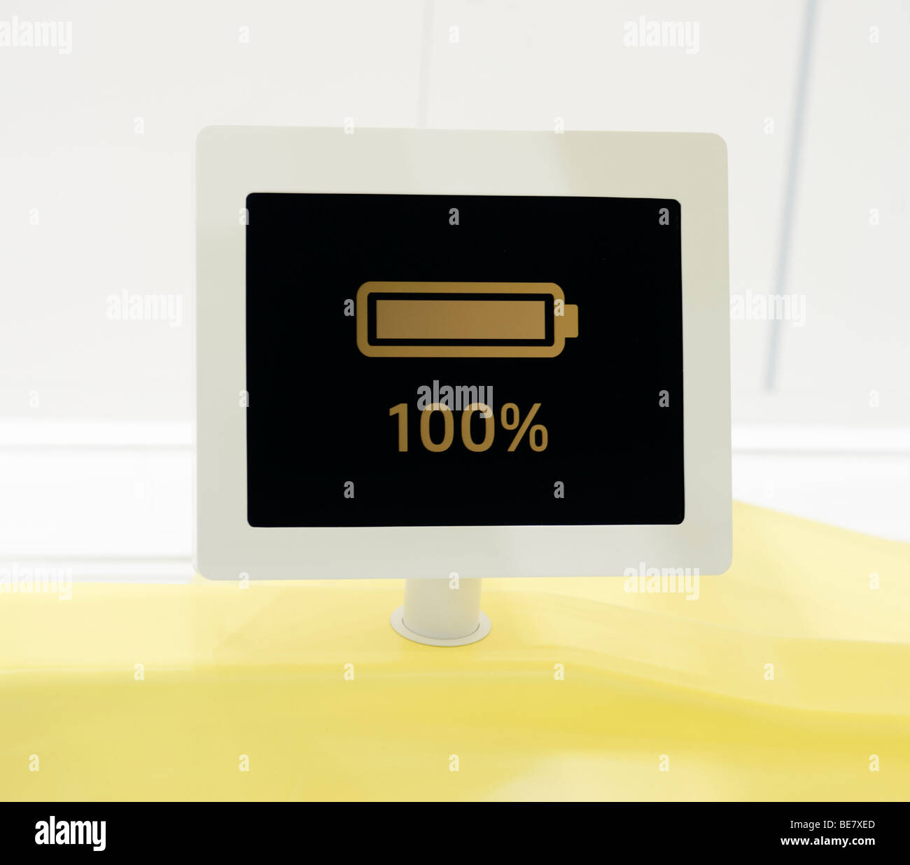 Detail of screen showing electric car battery has been recharged to 100 ...