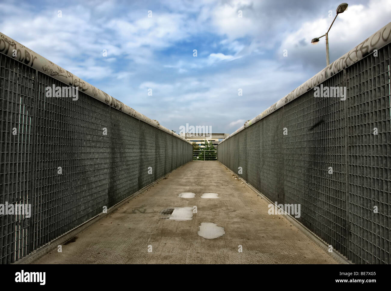Pedestrian overpass. Metal bridge crossing above the motorway Stock ...