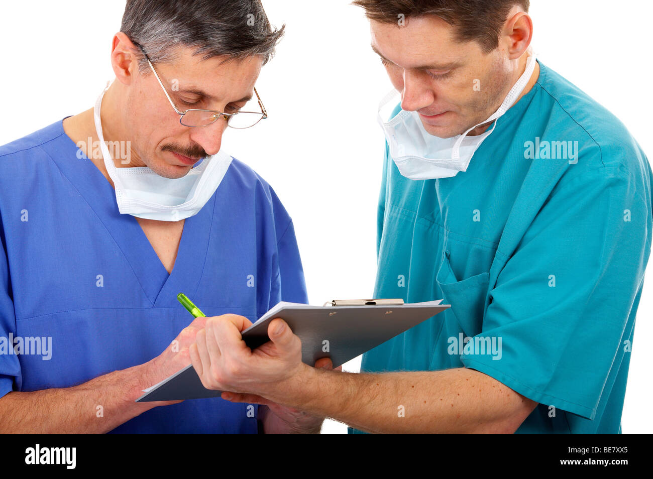 two doctors are working with schedule list Stock Photo - Alamy