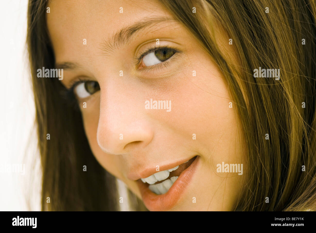 Girl glancing sideways at camera, portrait Stock Photo - Alamy