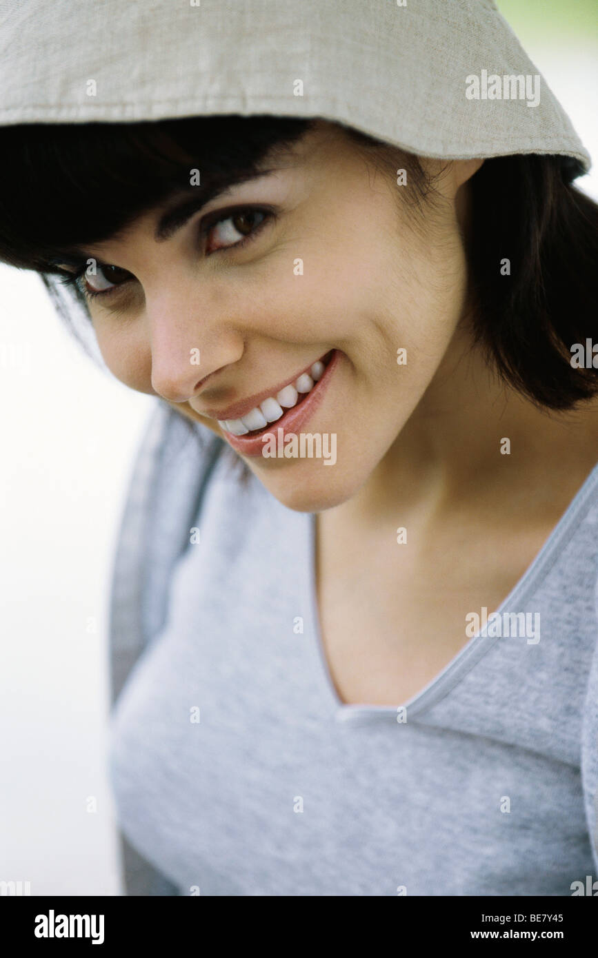 Woman smiling flirtatiously at camera, portrait Stock Photo - Alamy
