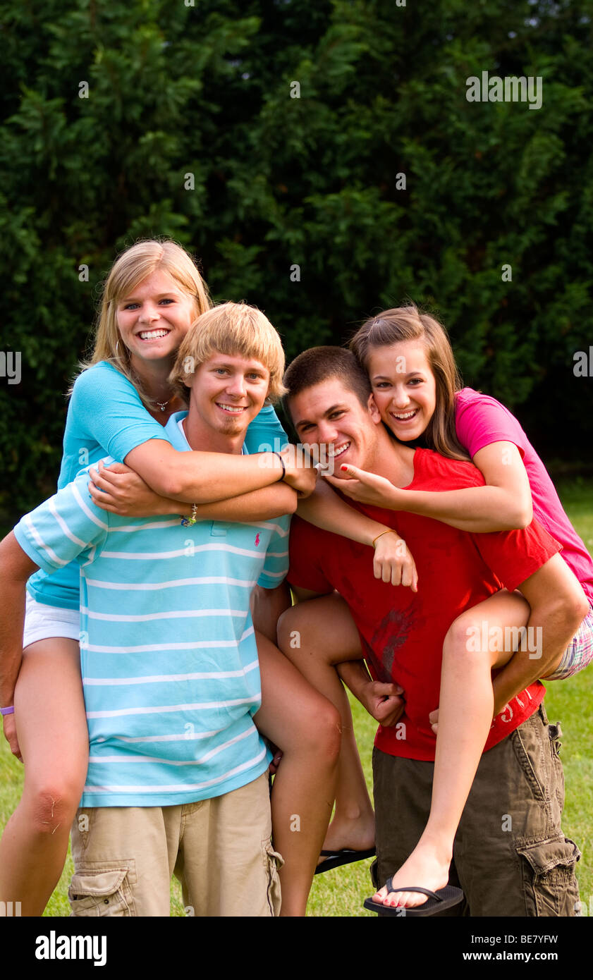 Modern teenagers aged 14 to 18 hanging out at home together as friends ...