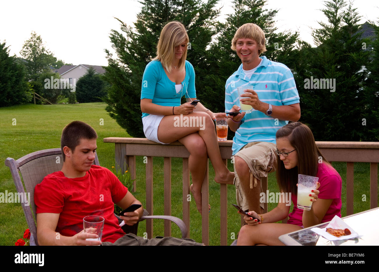 Modern teenagers aged 14 to 18 hanging out at home together as friends ...