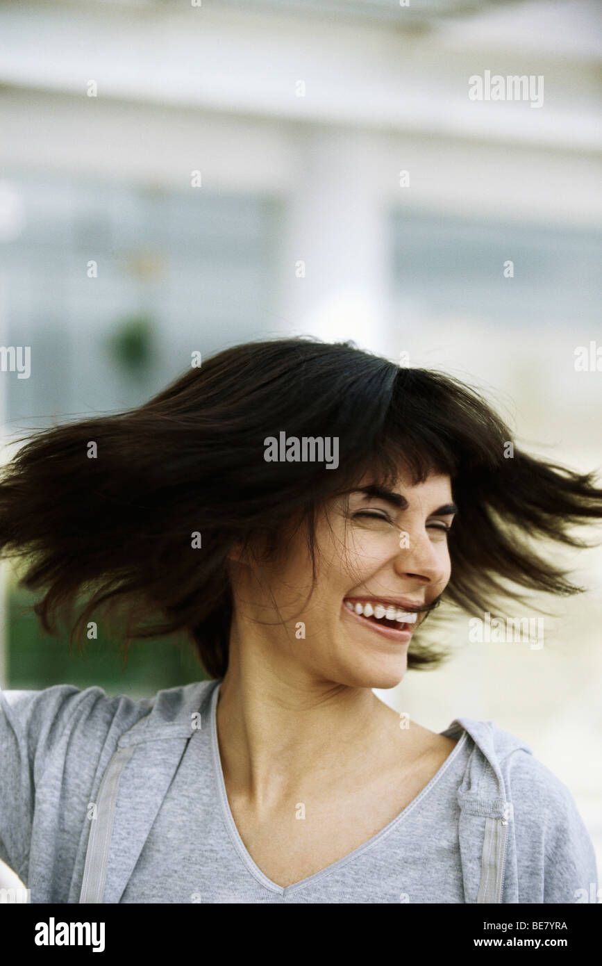 Woman tossing hair, portrait Stock Photo - Alamy