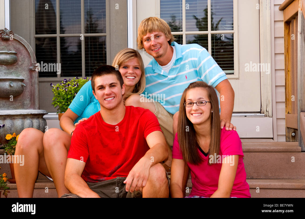 Modern teenagers aged 14 to 18 hanging out at home together as friends ...