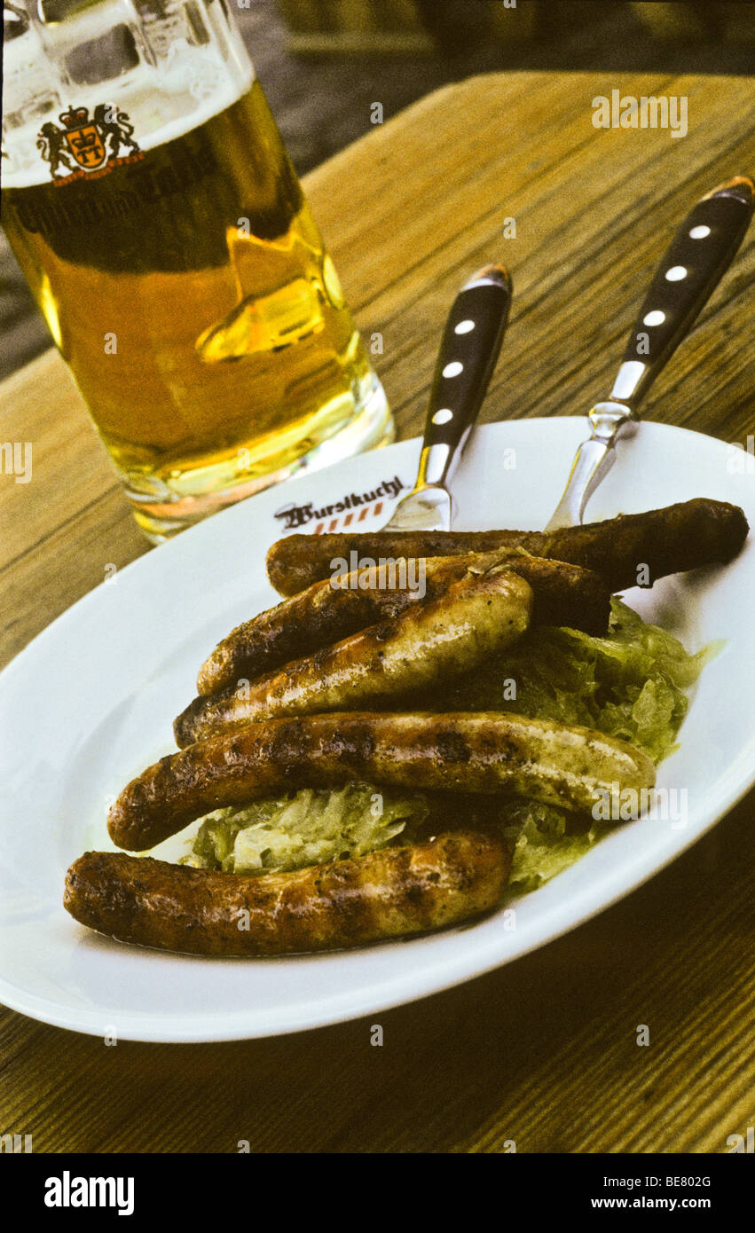 Typical German lunch snack of sausage brats sauerkraut and beer on ...