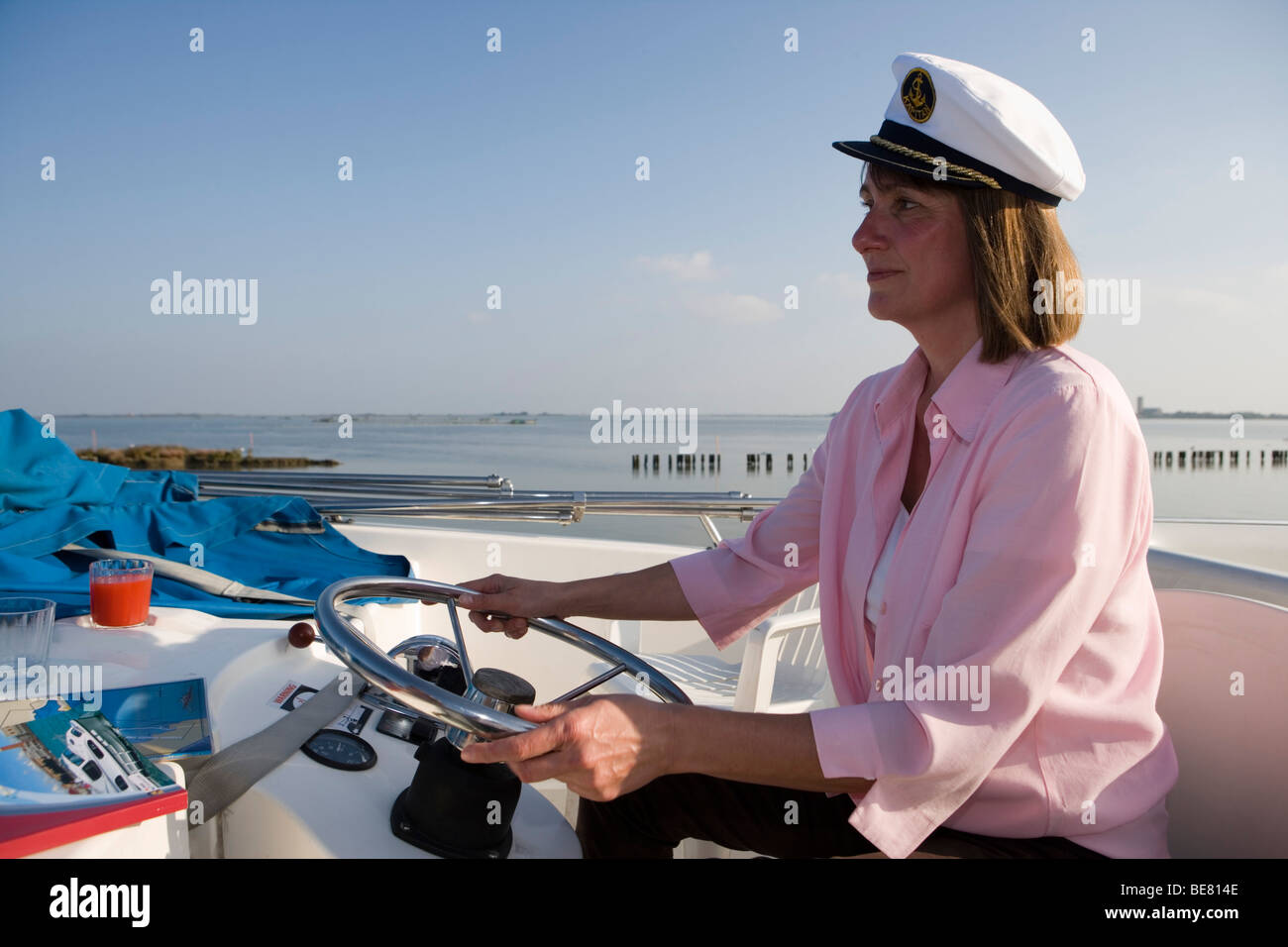 Woman Skipper aboard the houseboat Le Boat Magnifique, Torcello, Veneto ...
