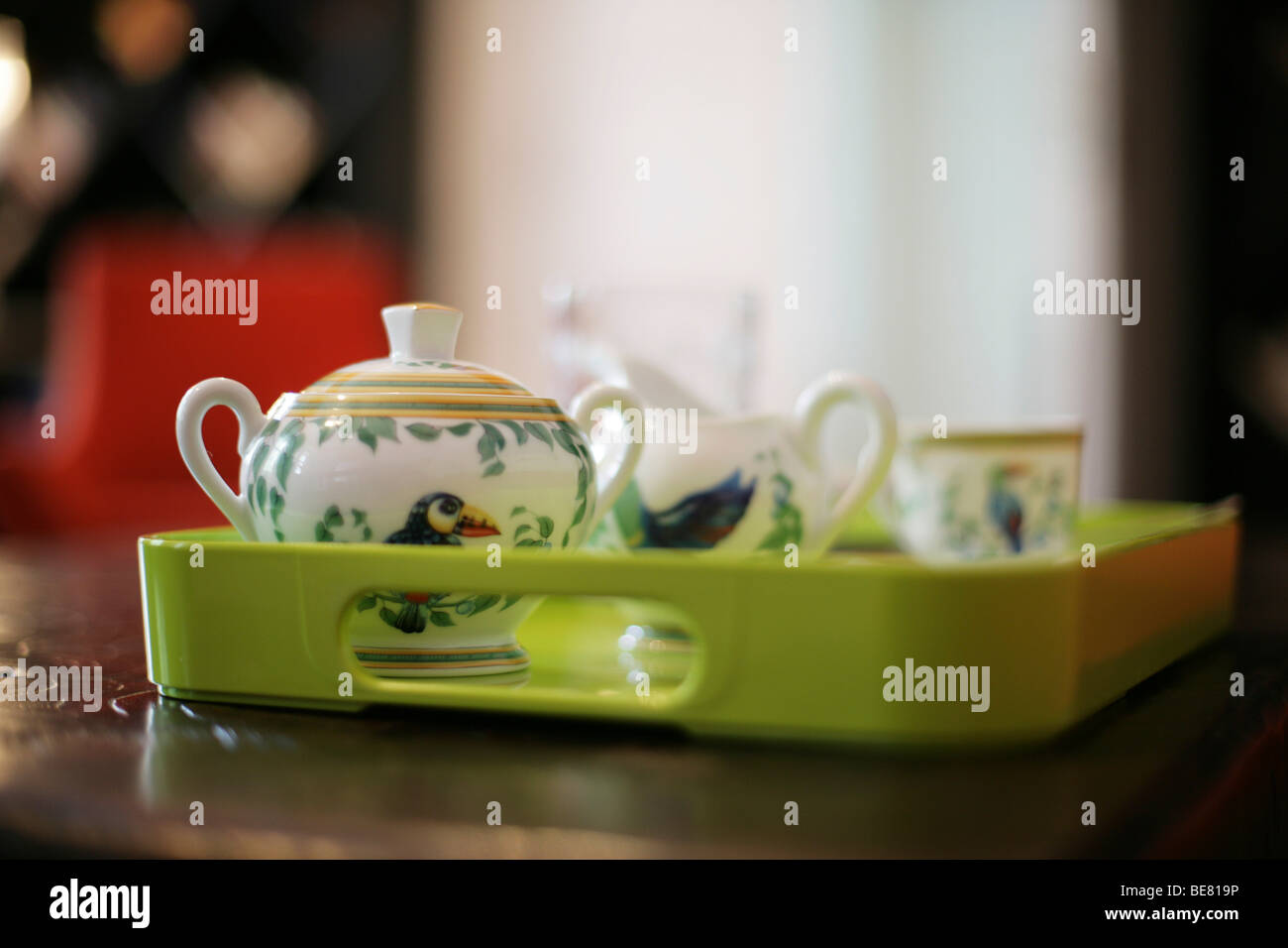 Green tray with tea dishes on a table Stock Photo - Alamy