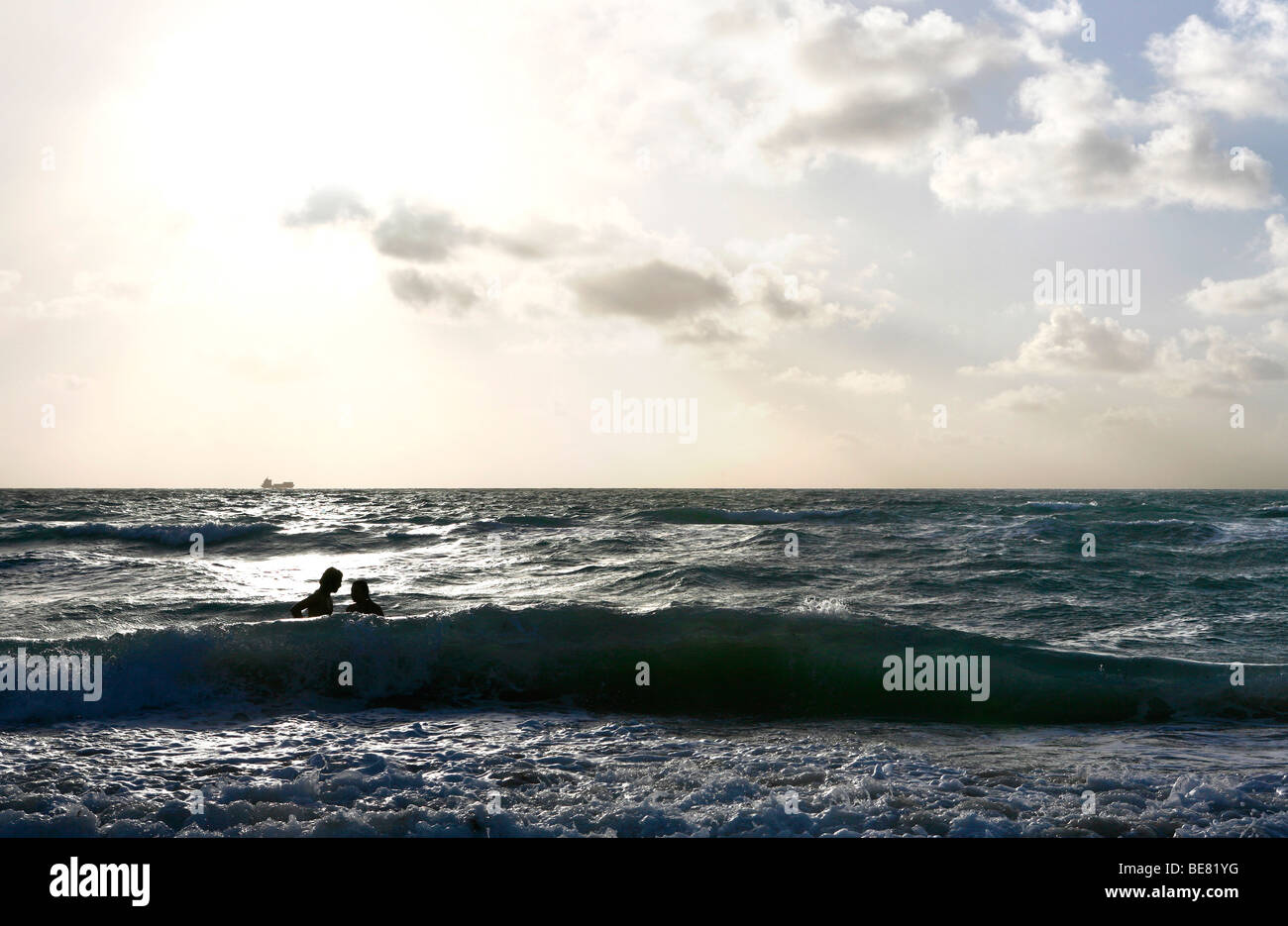 Couple bathing in the ocean, South Beach, Miami Beach, Florida, USA ...