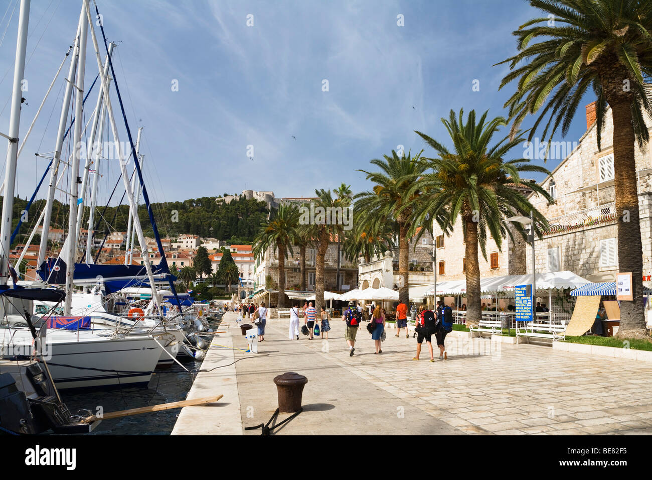 People strolling on the promenade of Hvar marina, Hvar Island, Dalmatia ...