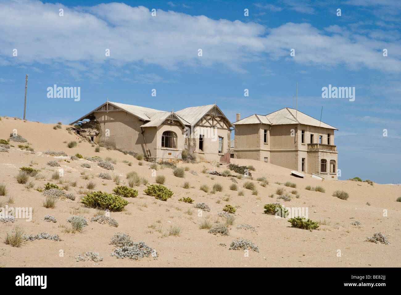 Abandoned buildings taken by the sand, Ghost town buildings, Kolmanskop ...