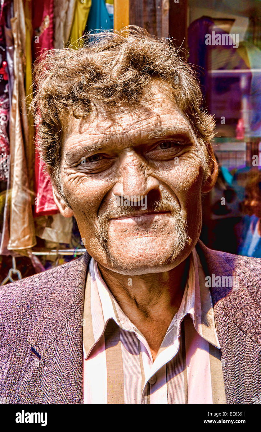 Tough looking giant man with extreme large head in city center in Lviv ...