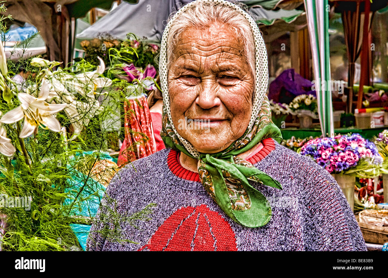 Old lady babushkas selling flowers at market in old town center city of ...